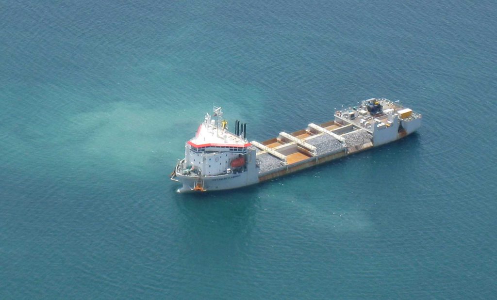 Side stone dumping vessels - IADC Dredging